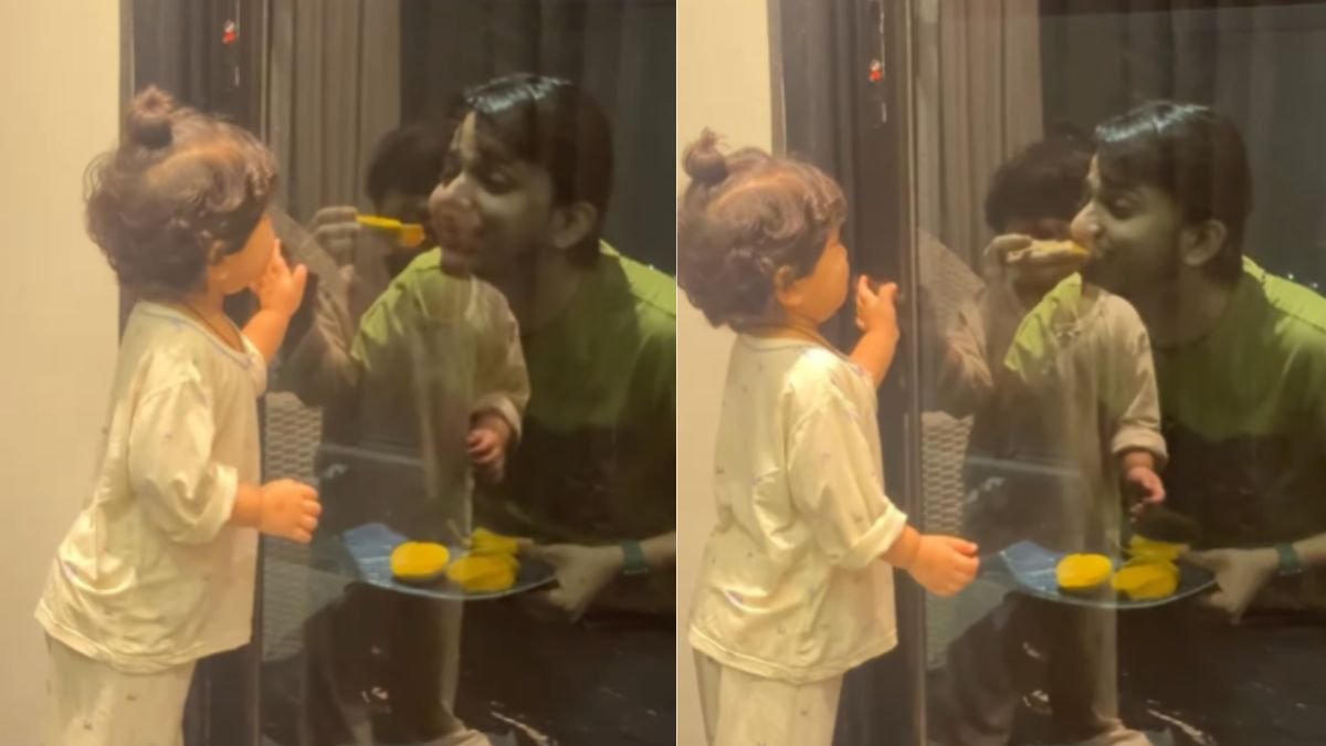 Daughter tries to break glass door as father teases her by eating ...